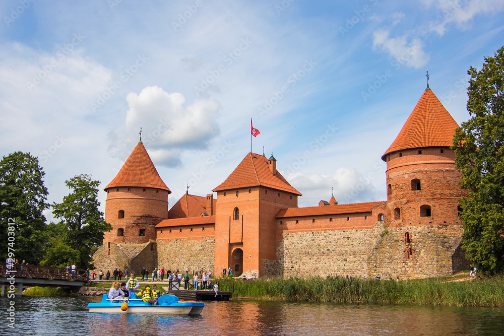 Yachts and medieval gothic Trakai Island Castle with stone walls and ...