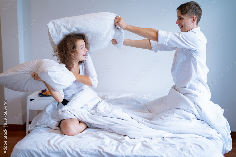 Pillow fight pajama party and Sleepover party ideas concept.Young happy ...