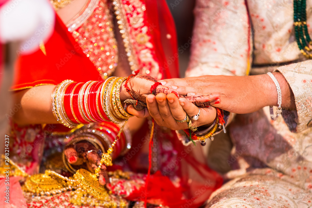 Closeup of indian couple holding hands as promise care and trust for ...