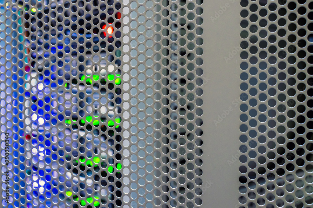 Racks with server hardware are located behind an iron door with round ...