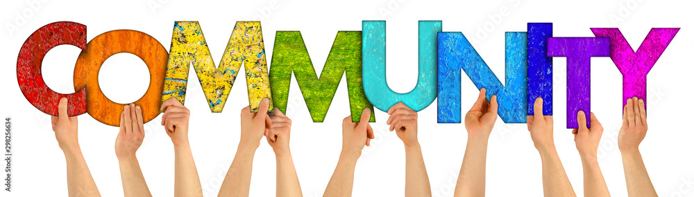 people holding up colorful rainbow wooden letter with words Community ...