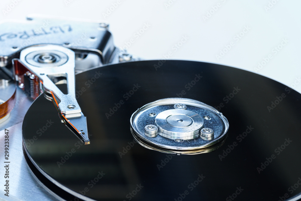 Inside hard drive cylinder and head macro. Stock Photo | Adobe Stock