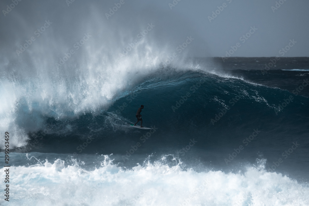 Confident surfer rides giant barreling wave at the famous Banzai ...