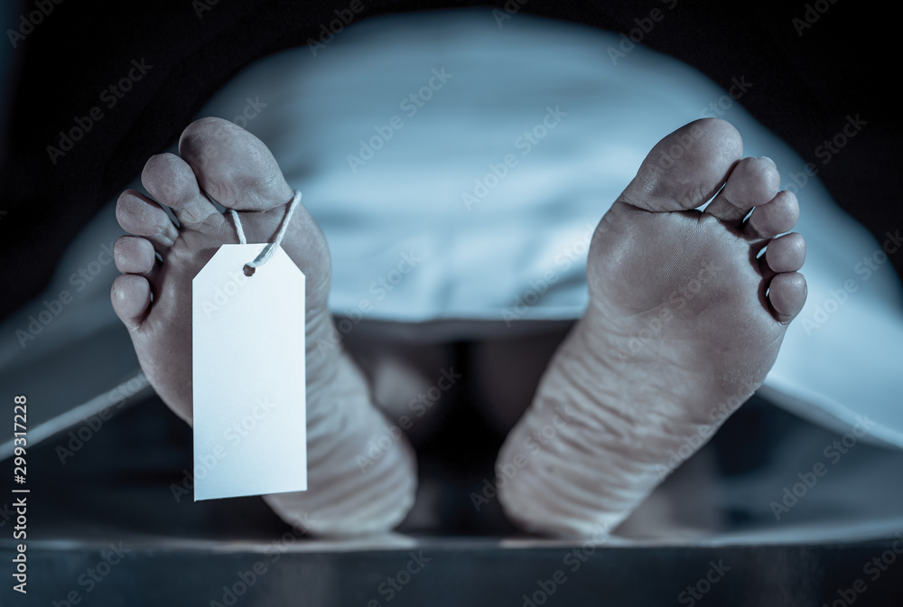 Cadaver on autopsy table at morgue, label tied to toe, close-up Stock ...