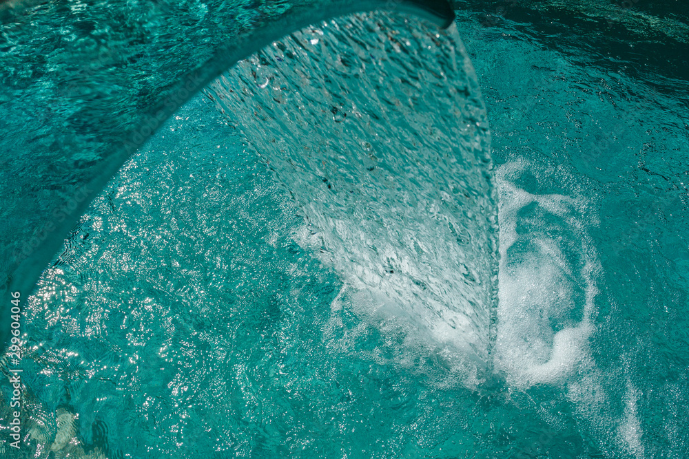 Waterfall. Water attraction in the pool. Hydromassage. Water massage ...