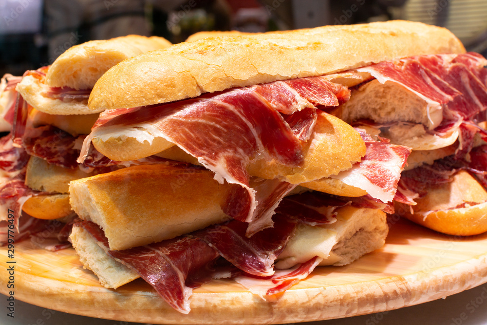Spanish street food bocadillo fresh bread with jamon iberico ready to ...