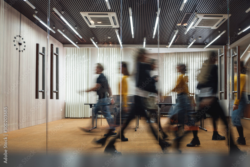Group of office employees at coworking center. Business people walking ...