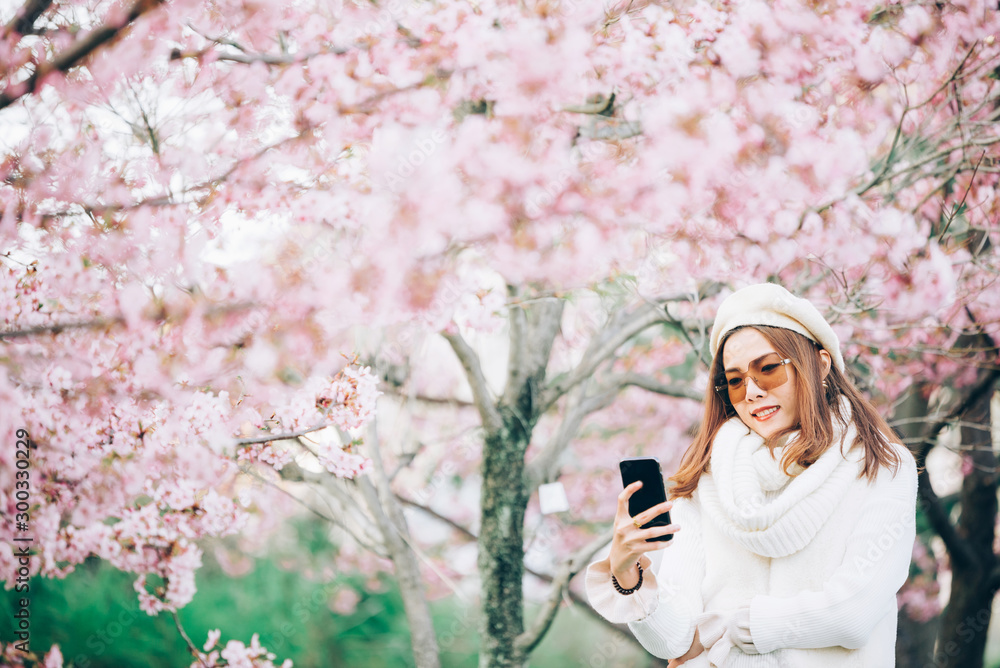 Woman taking self photo in spring season with cherry blossoms,sakura in ...