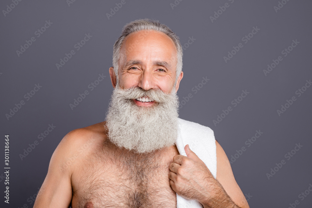 Portrait of positive well good old man with towel hanging on his ...