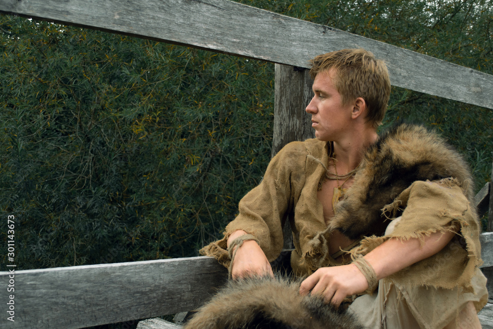 Downshifting concept - medieval peasant in a ragged clothes ...