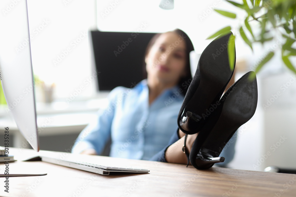 Beautiful woman resting at workplace Stock Photo | Adobe Stock