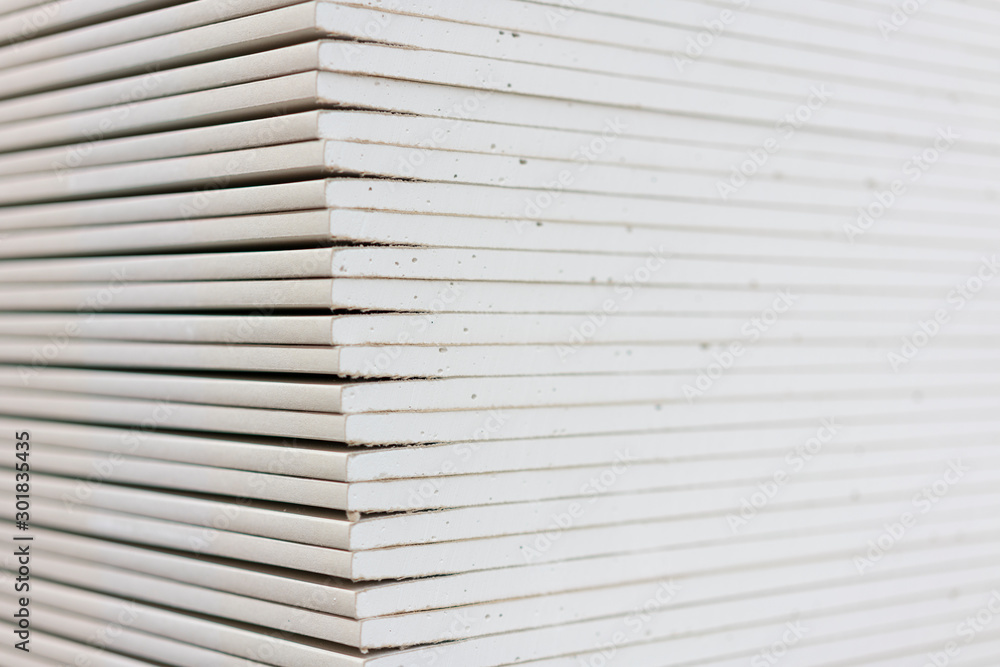 Gypsum plasterboard in the pack. The stack of gypsum board preparing ...