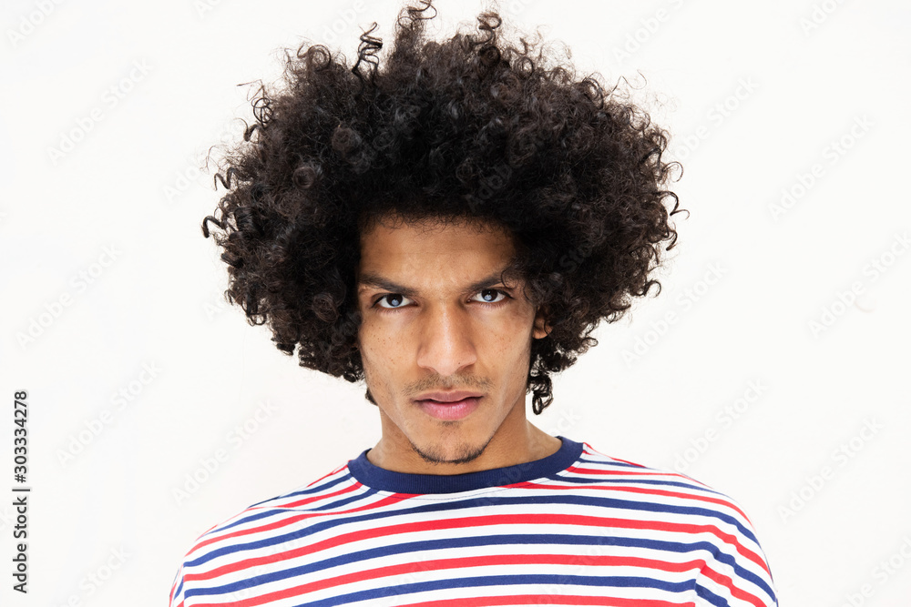 Close up front portrait handsome young North African man with afro ...