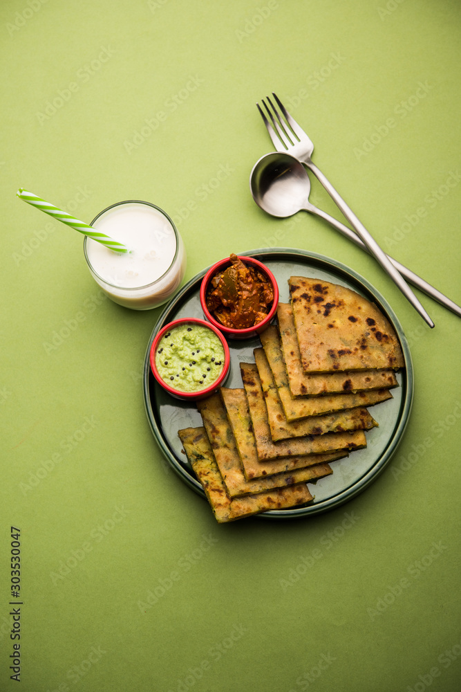 Aloo Paratha / Indian Potato stuffed Flatbread with butter on top ...