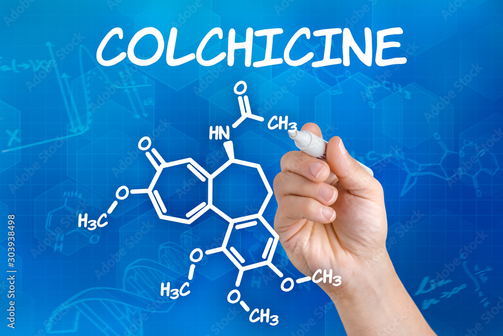 Hand with pen drawing the chemical formula of colchicine Stock Photo ...