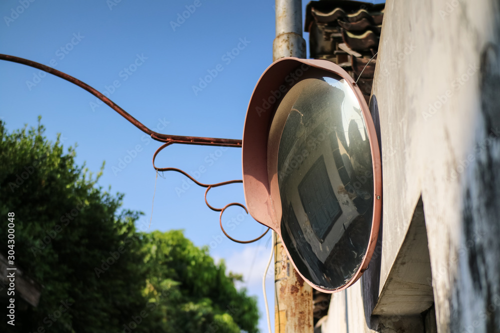 Convex mirror in wall. Safety mirrors with protective visor. Reflector ...