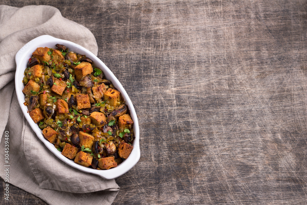 Vegan Stuffing with Mushrooms, Leeks and crunchy croutons on wooden ...