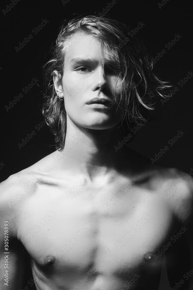 Muscle strong beautiful stripped male model portrait on isolated font ...