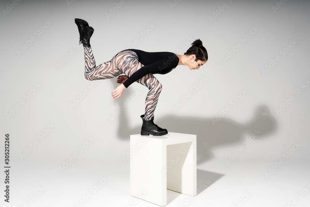 short haired model in female bodysuit, pantyhose with zebra print and ...
