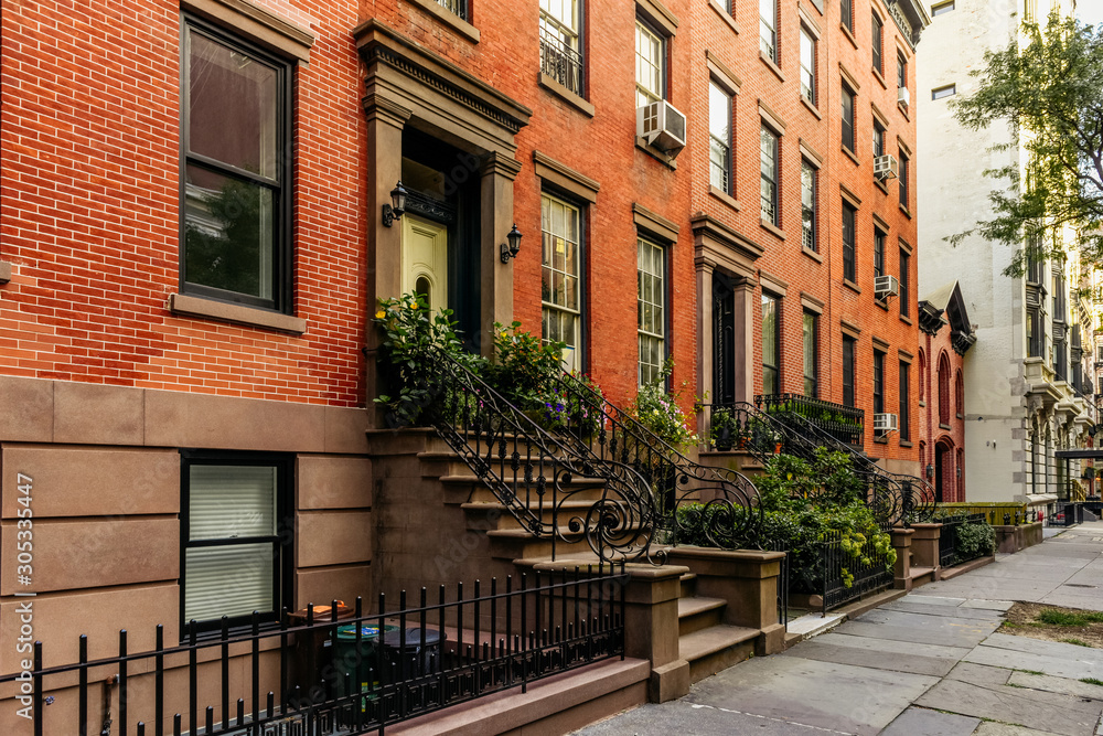 Brownstone facades & row houses at sunset in an iconic neighborhood of ...