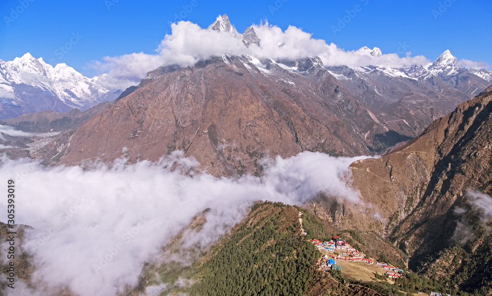 Epic aerial view of a mountain valley with Tengboche Buddhist Monastery ...