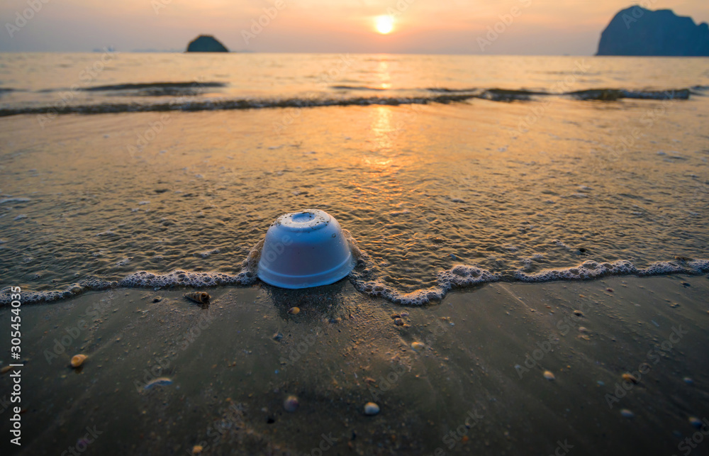 Styrofoam cup on tropical beach pollutes the sea and marine life ...