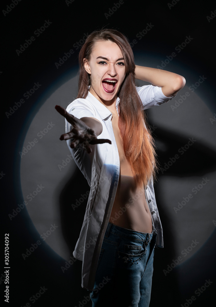 Beautiful Slim Topless Girl Wearing Jeans And An Unbuttoned Shirt Poses