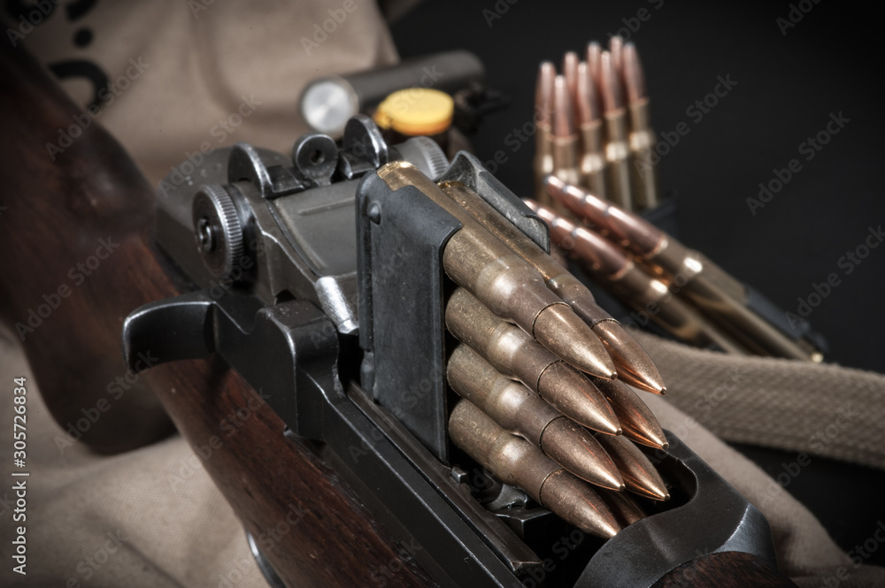 American WWII battle rifle M1 with 30-06 ammunition in en bloc clips ...