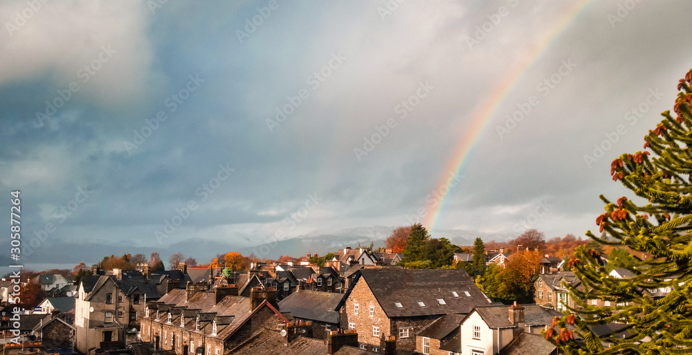 Aerial top view over Bowness On Windermere on an early morning with fog ...