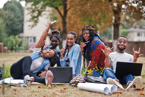 Group of five african college students spending time together on campus ...