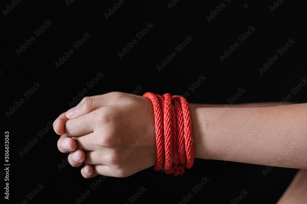 Foto human trafficking Concept.Hands tied up with rope of a missing ...