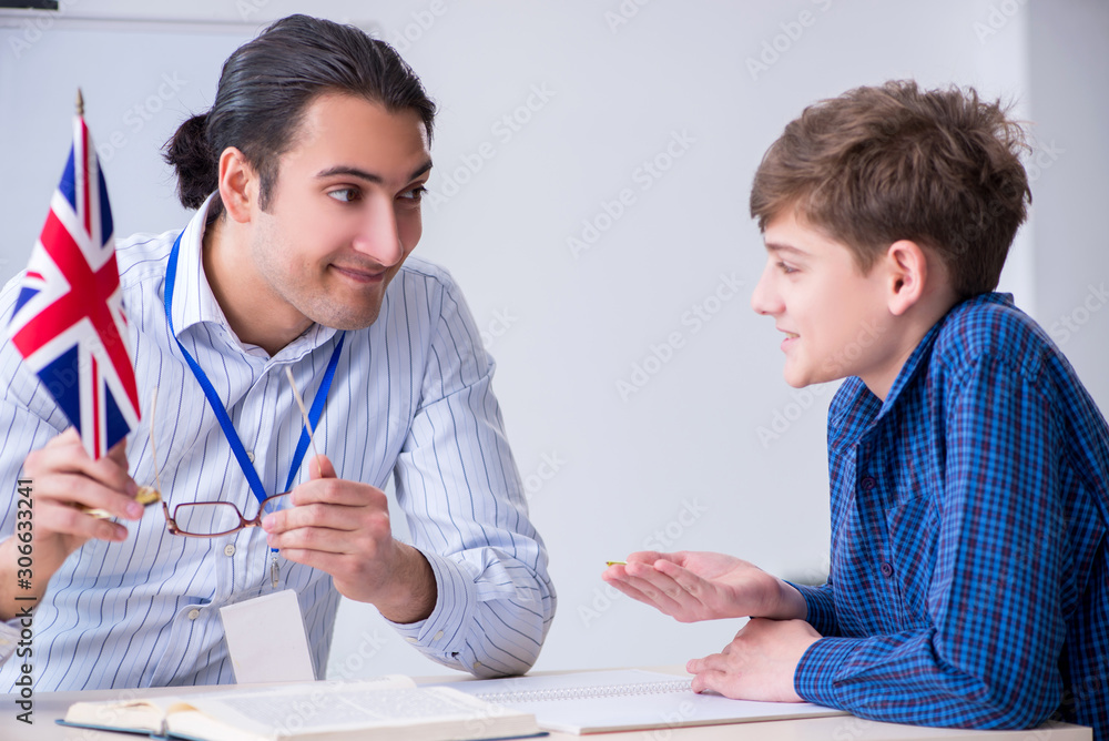 Male english teacher and boy in the classroom Stock Photo | Adobe Stock