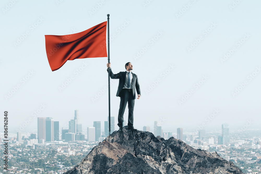 Happy businessman with red flag Stock Photo | Adobe Stock