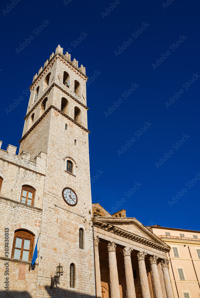 Medieval People's Tower and ancient roman Temple of Minerva in Assisi ...