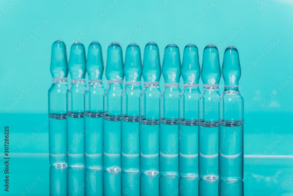 Glass medical ampoule vial for injection. Medicine is liquid sodium ...