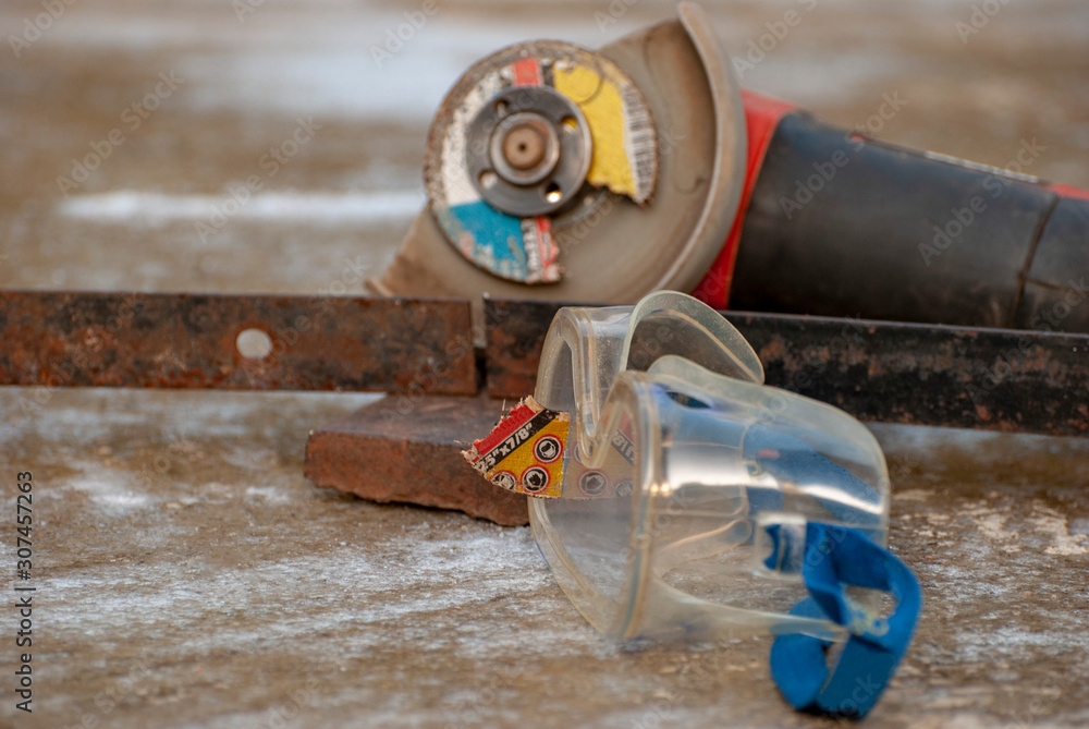 Angle grinder cutting disc element stuck in safety glasses Stock Photo ...