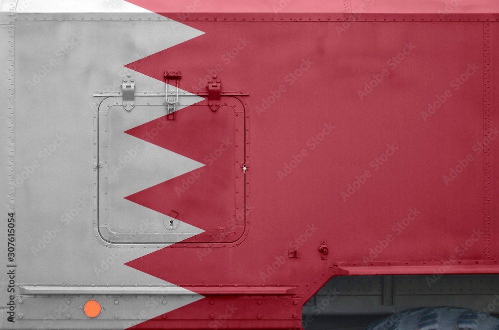 Bahrain flag depicted on side part of military armored truck closeup ...