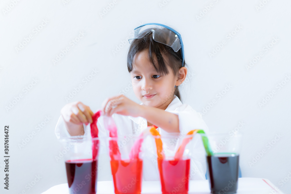 A 4 years old asian little girl is learning about color changing ...