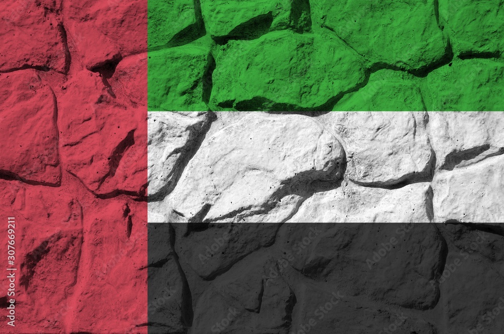United Arab Emirates flag depicted in paint colors on old stone wall ...
