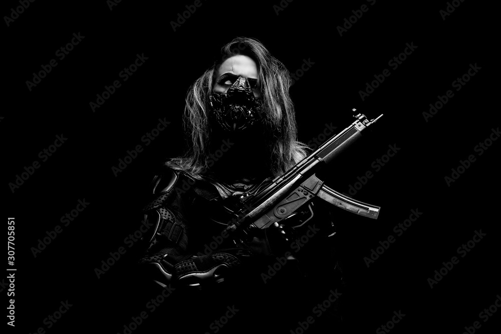 Young one-eyed Cyborg, wearing a mask, in combat armor, holding a ...