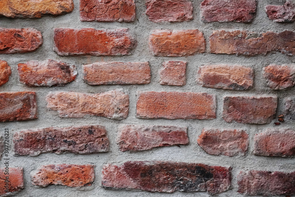 Fragment of the restoration of masonry of old red brick. different size ...