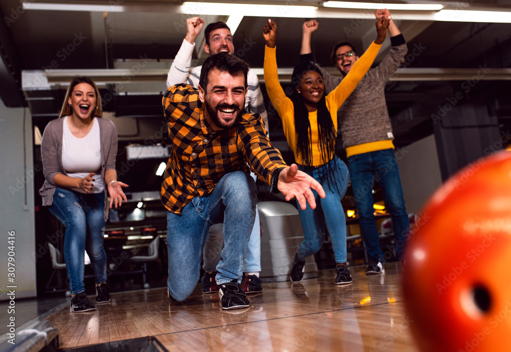 Group of friends enjoying time together laughing and cheering while ...