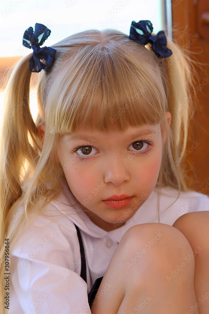 Nice cute sweet tender cheerful positive small little girl with curly ...