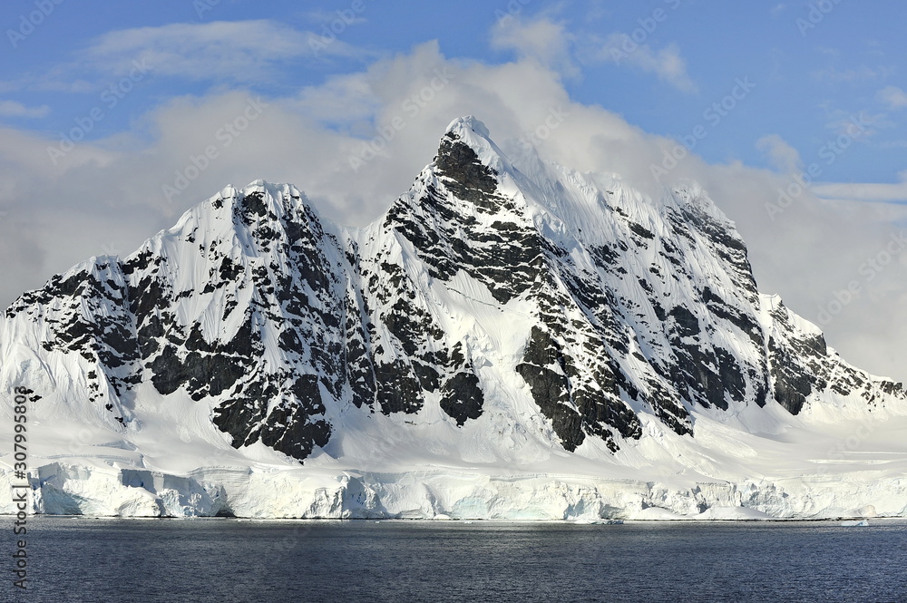 The majestic and harsh nature of Antarctica. Mountains covered by ice ...