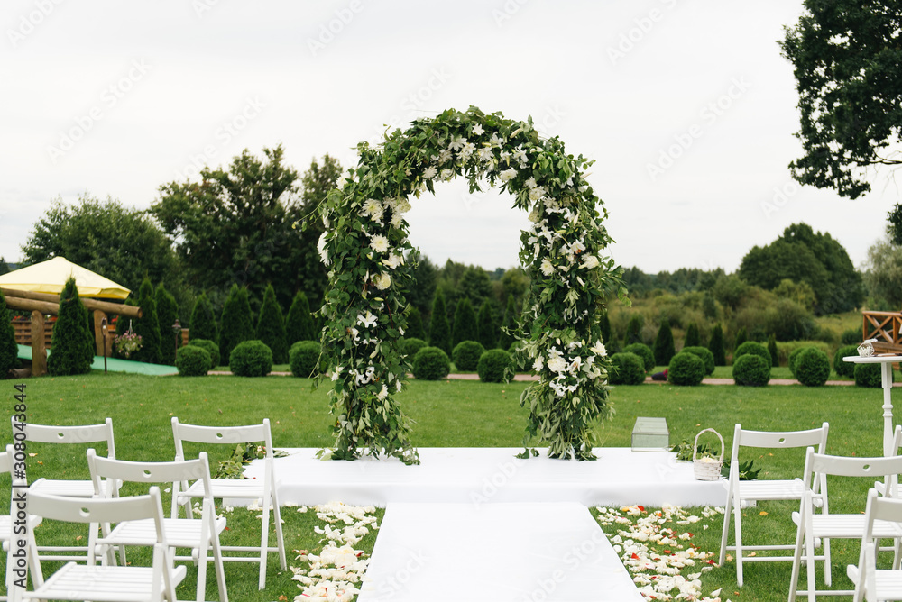 Arch for the wedding ceremony. Arch, decorated with beautiful fresh ...