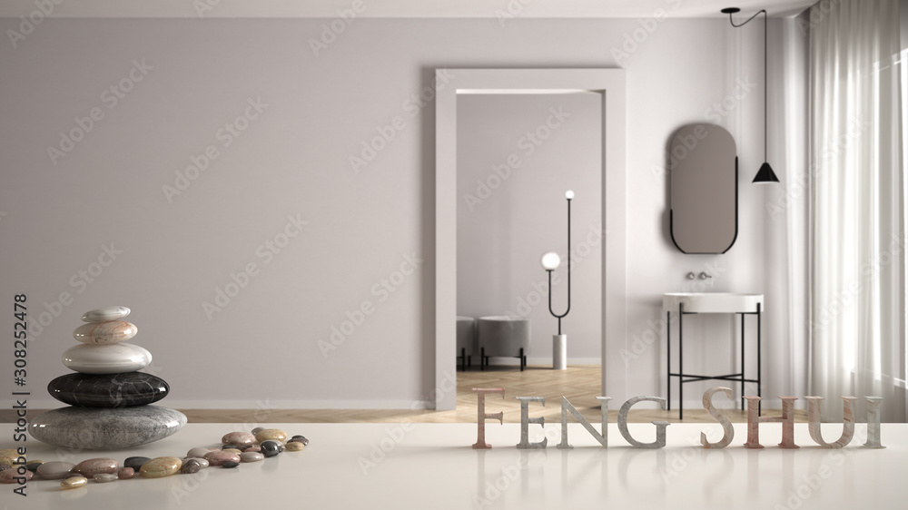 White table shelf with pebble balance and 3d letters making the word ...