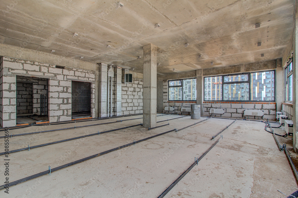 Drywall installation work in progress by construction workers at ...