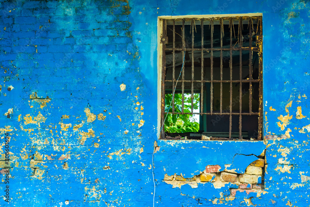 Abandoned vintage brick wall building with rotting metal burglar bars ...