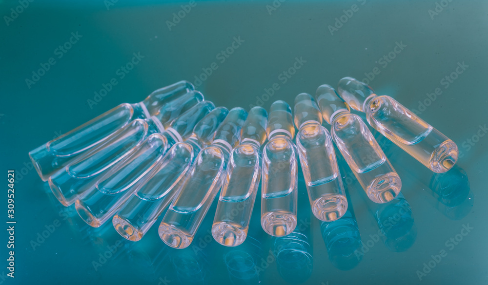 Glass medical ampoule vial for injection. Medicine is liquid sodium ...