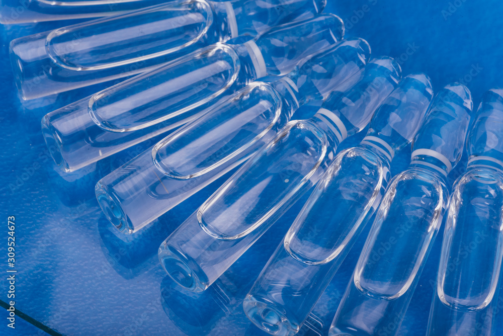 Glass medical ampoule vial for injection. Medicine is liquid sodium ...